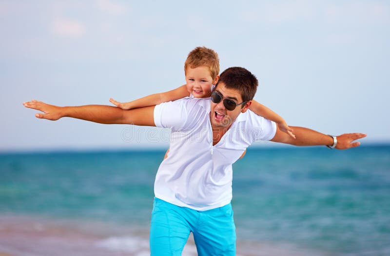 Joyful Father and Son Having Fun on the Beach Stock Image - Image of ...