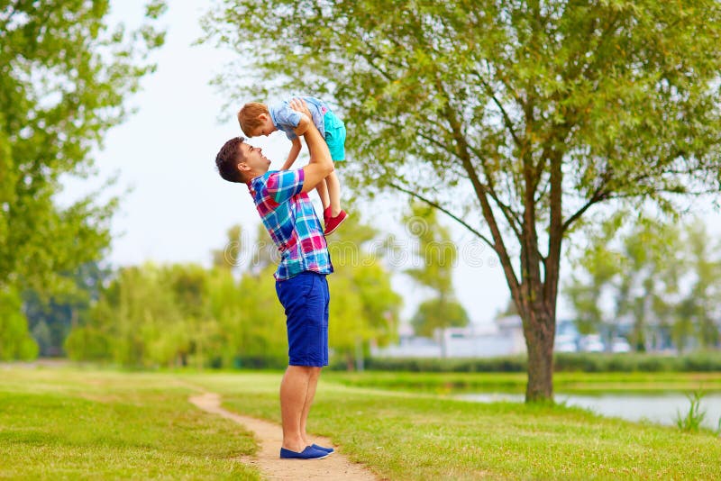 Joyful Father and Son Having Fun in Waterpark Pool, Summer Holidays ...