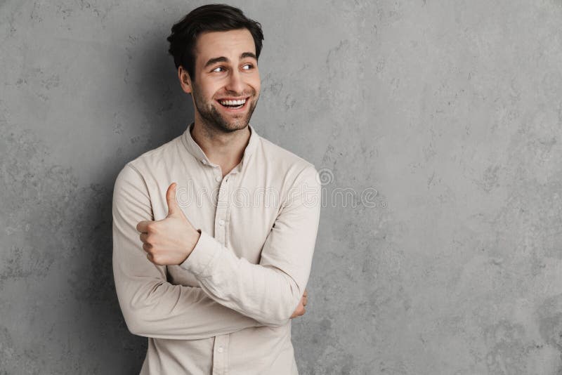 Joyful Handsome Guy Smiling and Showing Thumb Up Stock Image - Image of ...
