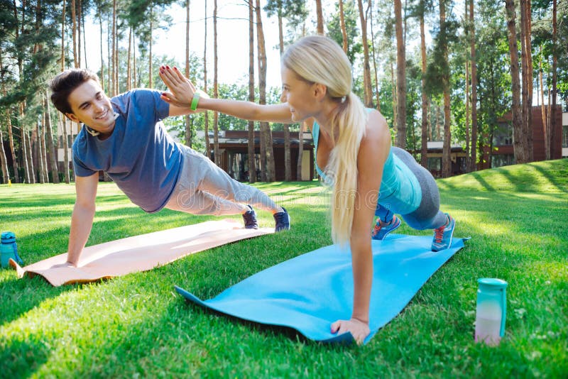 Joyful Happy Couple Doing Push Ups with One Hand Stock Image - Image of ...