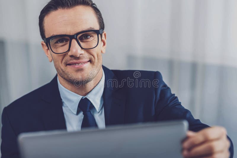 Joyful Intelligent Man Looking at You Stock Photo - Image of device ...