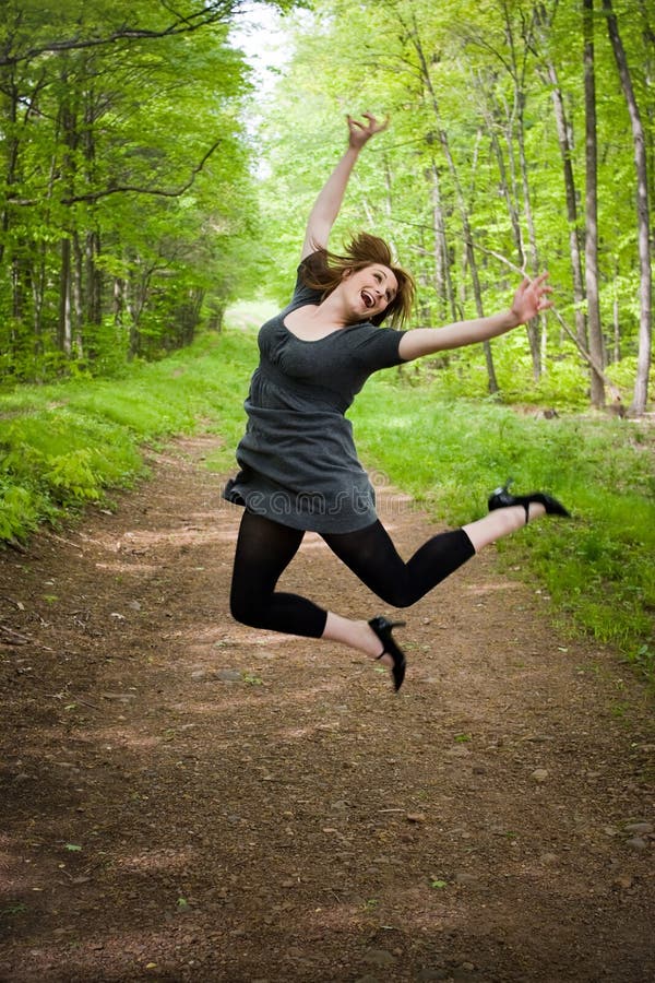 Joyful Jumping Woman stock photo. Image of beauty, dancing - 12107604