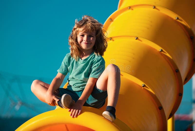 Joyful Kid Boy Having Fun on Playground Outdoors. Funny Kids Face ...
