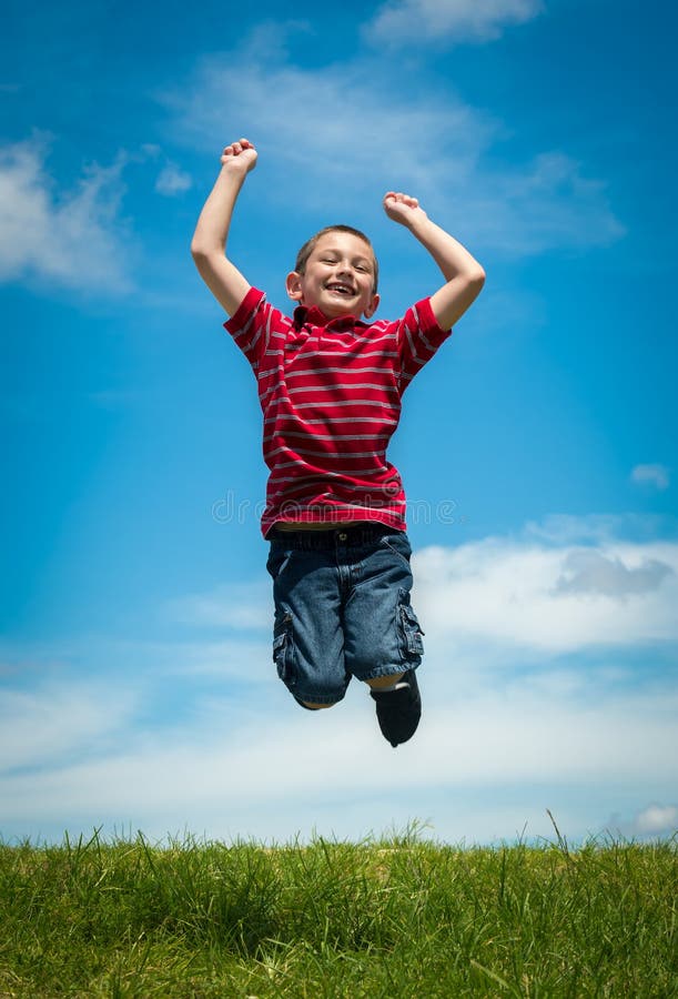 Joyful kid jumping happy stock image. Image of happiness - 25148545