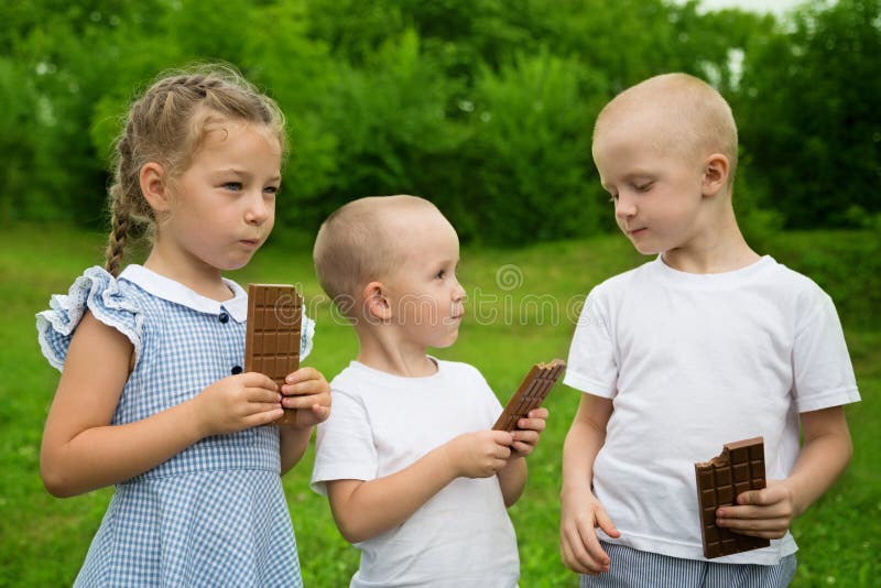 Joyful Kids Eating Chocolate Stock Image - Image of girl, little: 61241941
