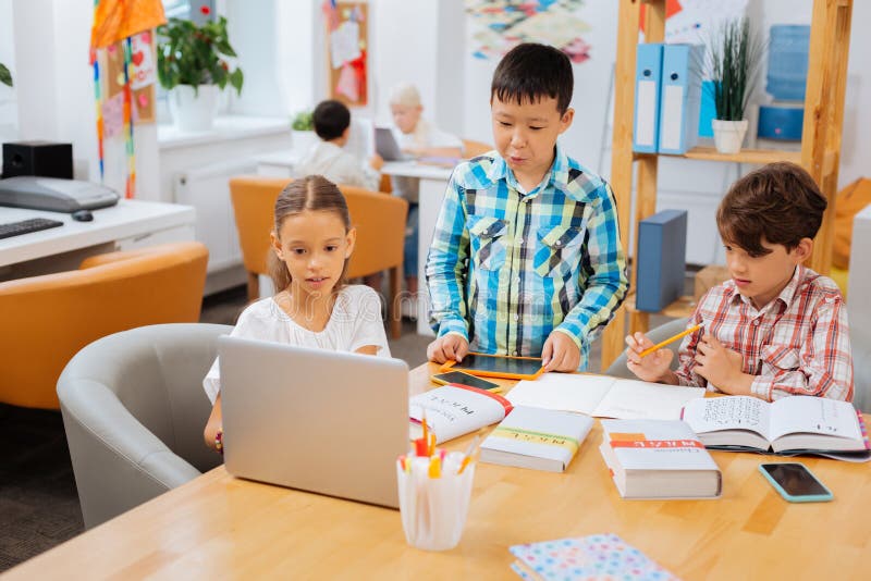 Joyful Kids Writing an Exercise in a Classroom Stock Image - Image of ...