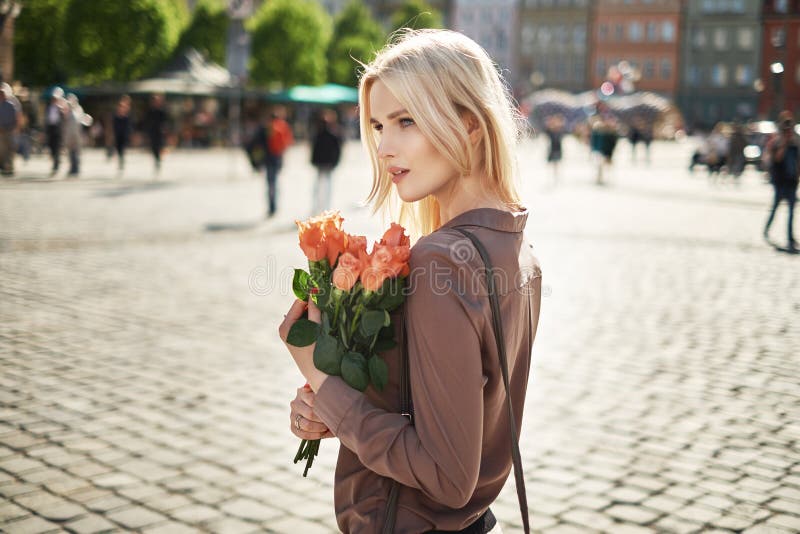 Joyful Lady Holding a Bouquet of Fresh Roses Stock Photo - Image of ...