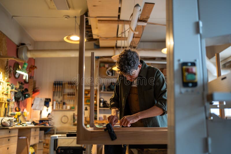 Joyful Man Carpenter Working with Handmade Table. Joiner Feels ...