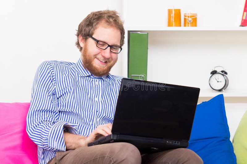Joyful Man Chatting by Computer Stock Image - Image of bedroom, room ...