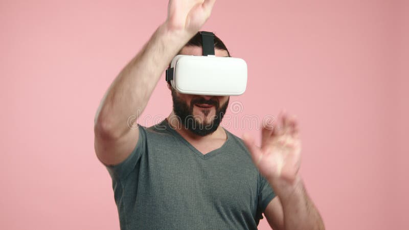 Joyful Man Pointing while Exploring Virtual Worlds with VR Headset ...