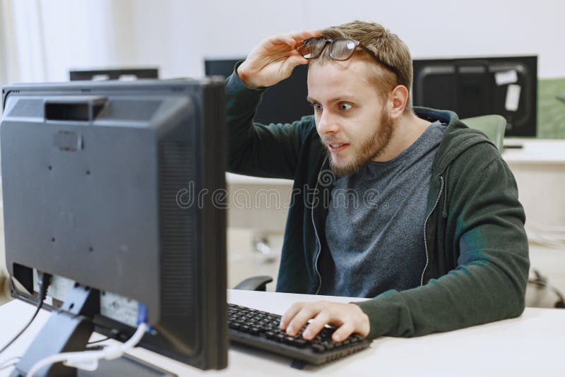 Joyful Man Sitting at the Computer. Stock Photo - Image of office, male ...