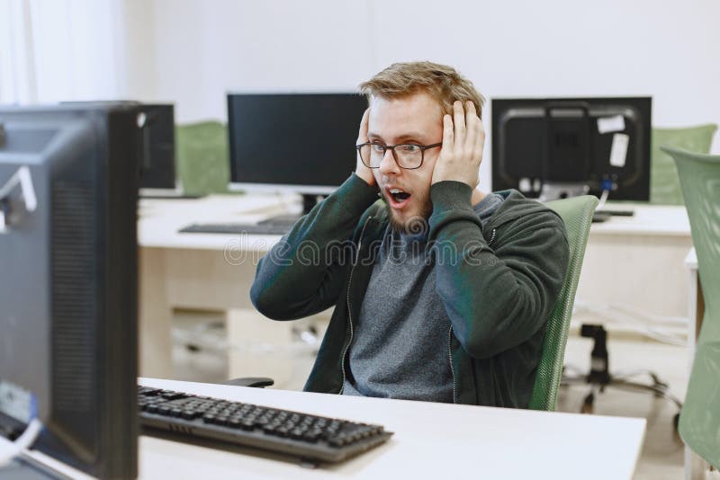 Joyful Man Sitting at the Computer. Stock Image - Image of indoor ...