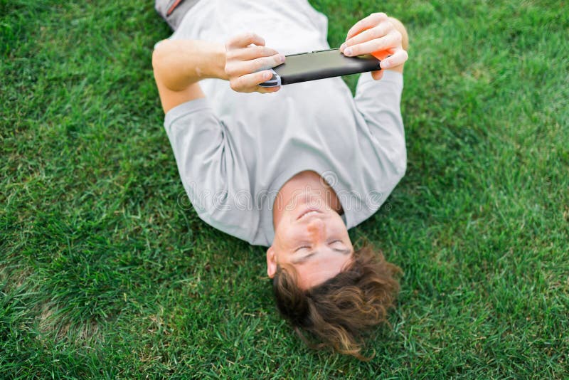 Joyful Man Smiling and Having Fun while Playing Video Games with ...
