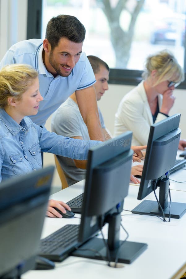 Joyful Man Teaching Students Stock Photo - Image of millennial, device ...