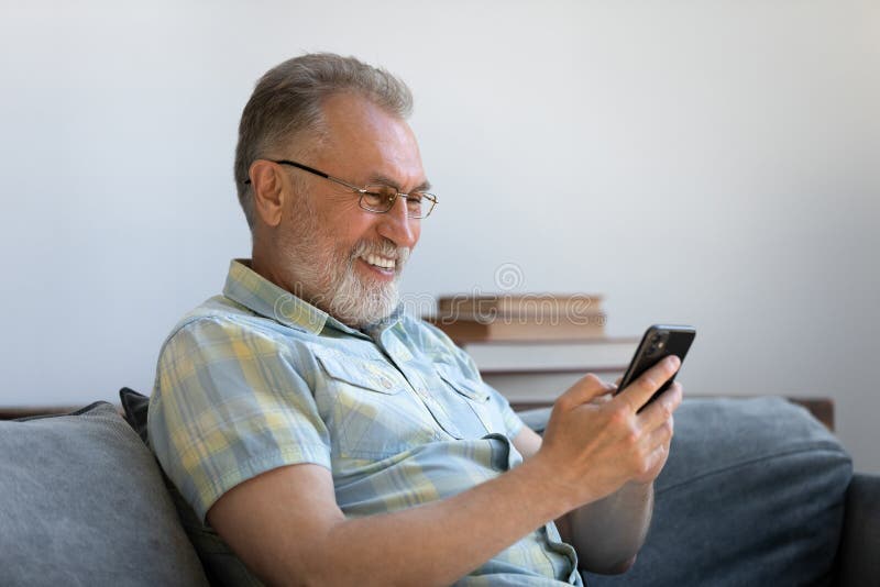 Joyful Middle Aged Old Man Using Cellphone. Stock Photo - Image of rest ...