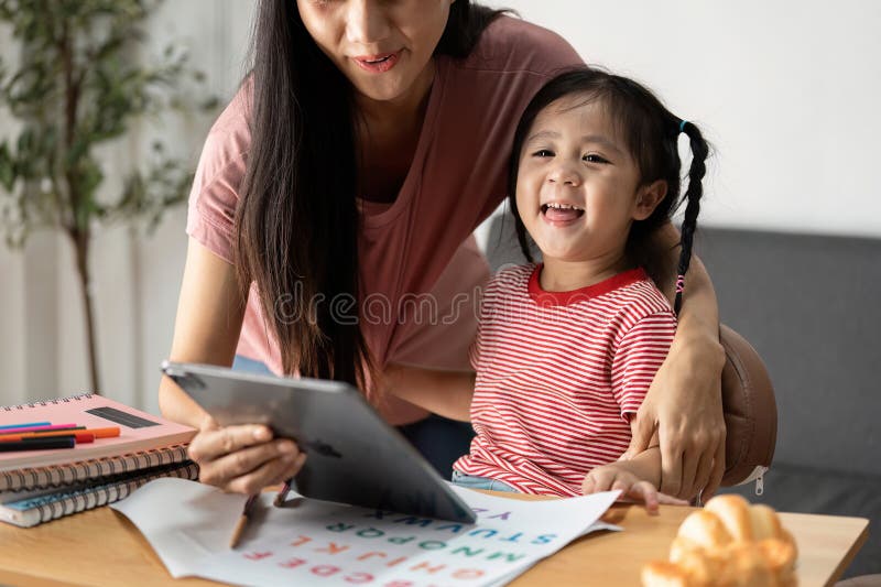 Mother and Daughter Enjoying Educational Activities Together at Home ...