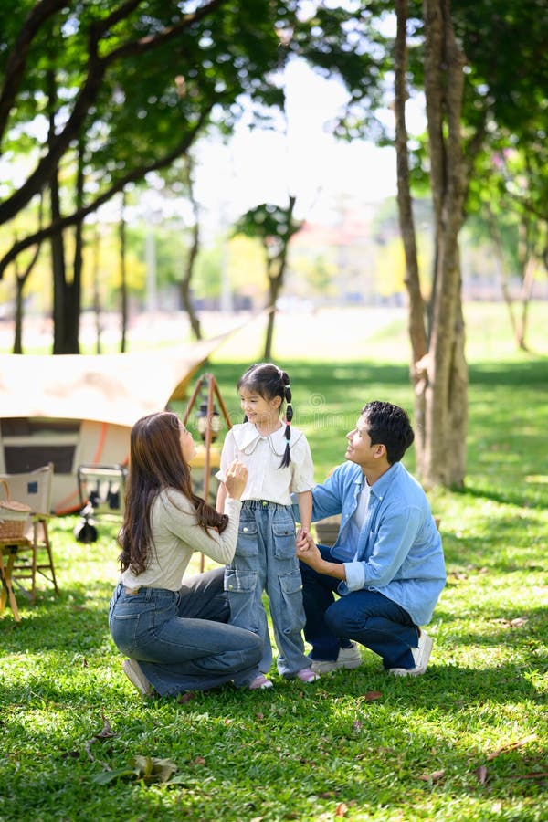 Joyful Parents and Child Bonding in Nature during a Sunny Camping Day ...