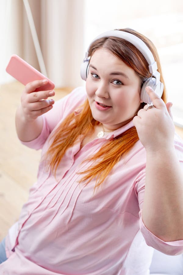 Joyful Pleasant Woman Wearing Earphones On Her Head Stock Image Image