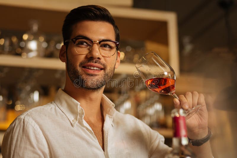 Joyful Positive Man Holding a Glass of Wine Stock Photo - Image of ... Joyful Positive Man Holding a Glass of Wine Stock Photo - Image of ...