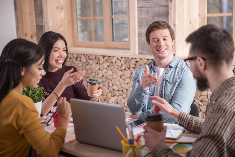 Joyful Positive People Exchanging Ideas Stock Photo - Image of device ...