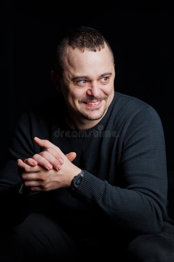 A Joyful Reflection: the Contemplative Smile of a Man Stock Photo ...