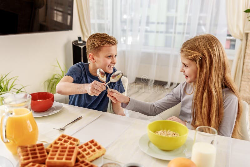 Joyful Siblings Having Fun before Breakfast Stock Image - Image of ...