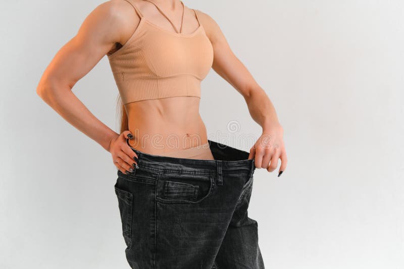 Joyful Slim Girl Showing Result of Diet Stock Photo - Image of closeup ...