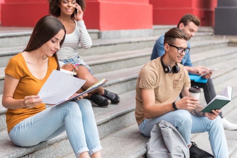 Cheerful Young Group Mates Studying Outdoors Stock Image - Image of ...
