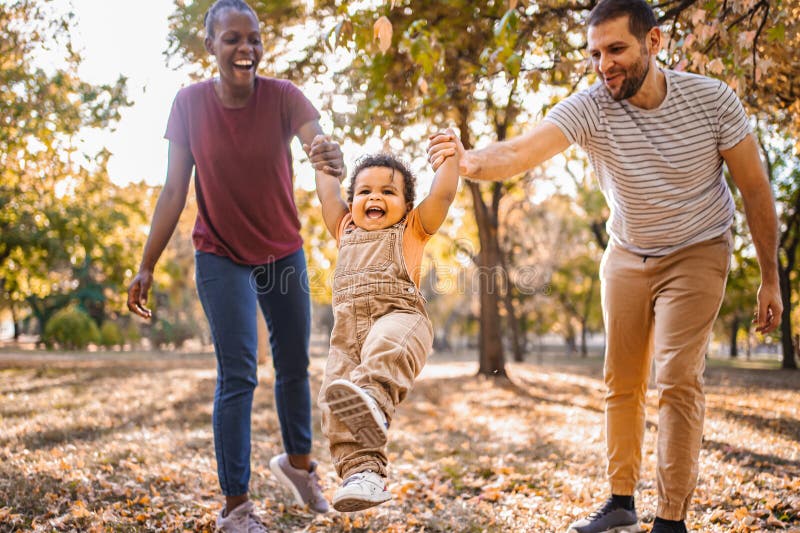 Joyful Swing between Parents in the Park Stock Photo - Image of recreation, bonding: 362876244
