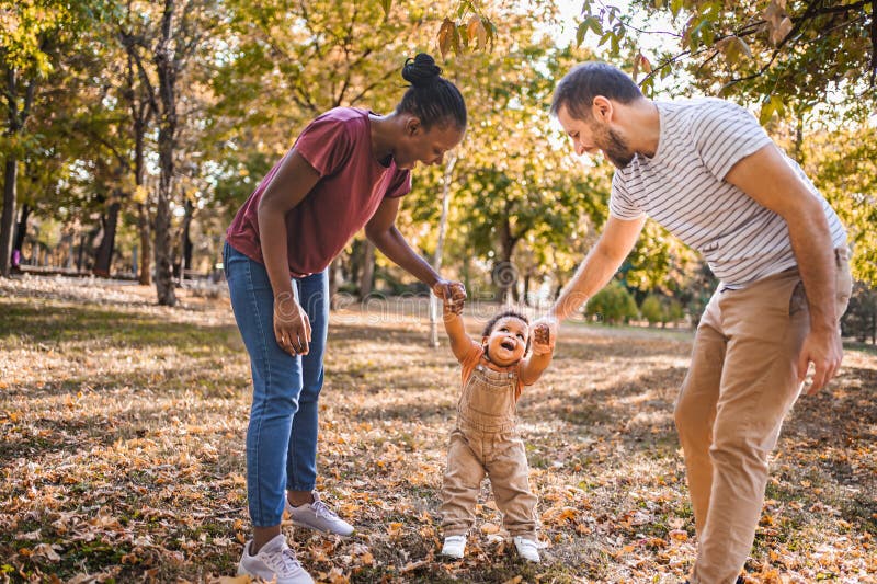 Joyful Swing between Parents in the Park Stock Photo - Image of swinging, playing: 362725660