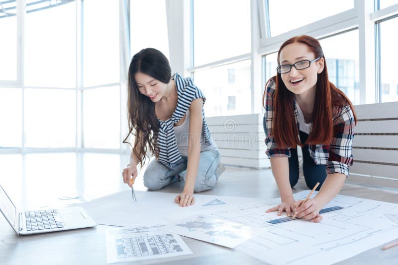 Joyful Young Engineers Working on a Project Stock Photo - Image of ...