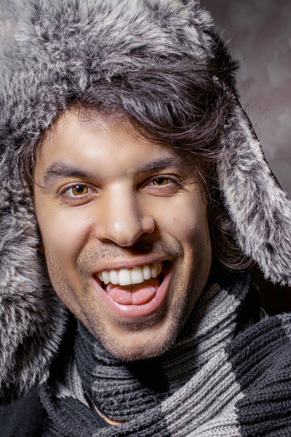 Joyful Young Guy in a Warm Fur Hat Stock Image - Image of beautiful ...