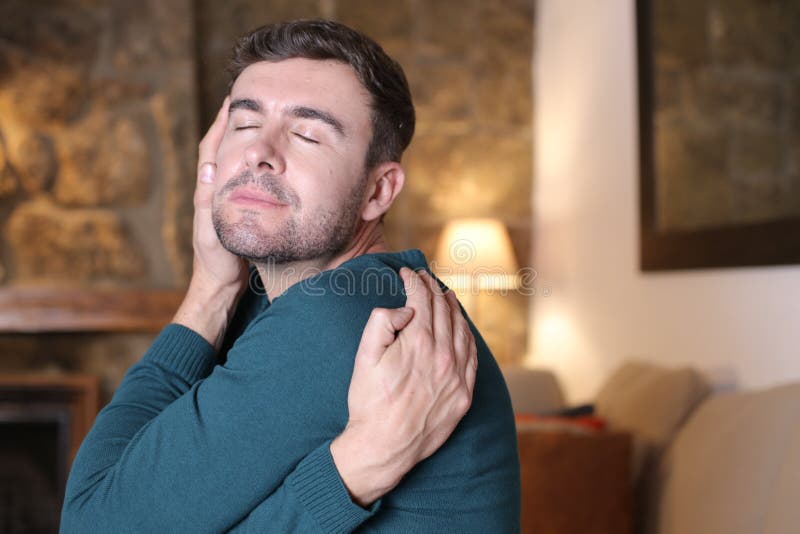 Joyful Young Man Hugging Himself Stock Image - Image of cuddling ...