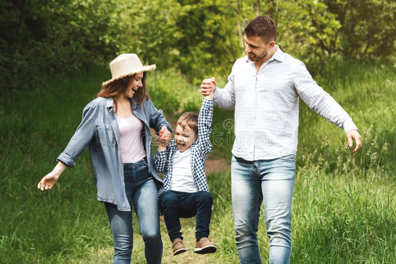 Joyful Young Parents Having Fun with Their Sun on Walk in Beautiful ...