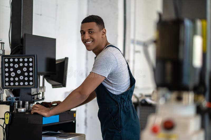 Joyous Auto Mechanic Working on the Desktop PC Stock Photo - Image of ...