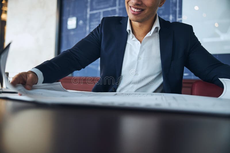 Joyous Male Architect Analyzing a Technical Drawing Stock Photo - Image ...