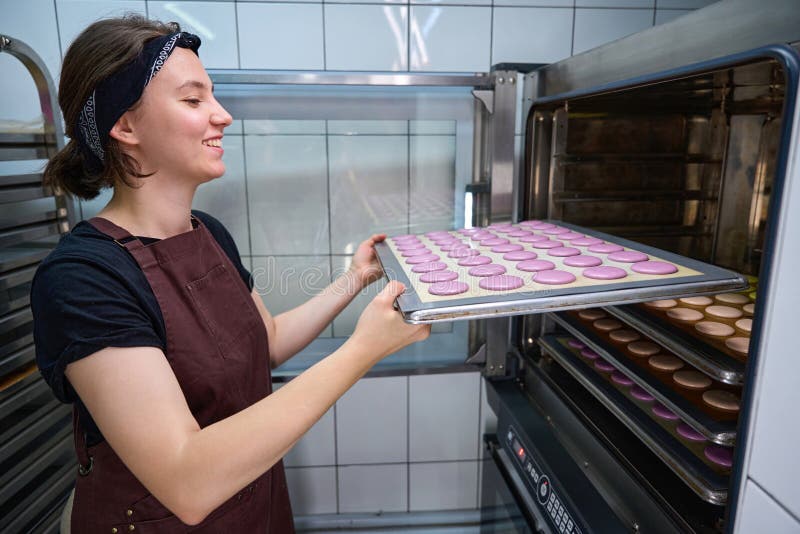 Joyous Young Baker is Baking Cookies in Bakery Kitchen Stock Photo ...
