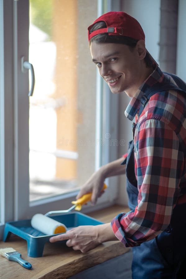 Joyous Young Painter Preparing for Painting Work Stock Photo - Image of ...