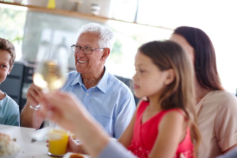 The Joys of Family. a Happy Multi-generational Family Having a Meal ...