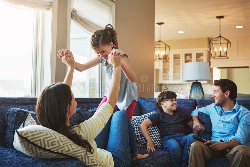 The Joys of Family Life. a Happy Family Bonding Together at Home. Stock ... The Joys of Family Life. a Happy Family Bonding Together at Home. Stock ...
