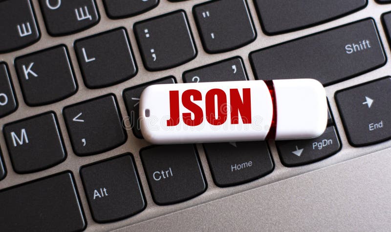 JSON - the Word on a White Flash Drive, Lying on a Black Laptop ...