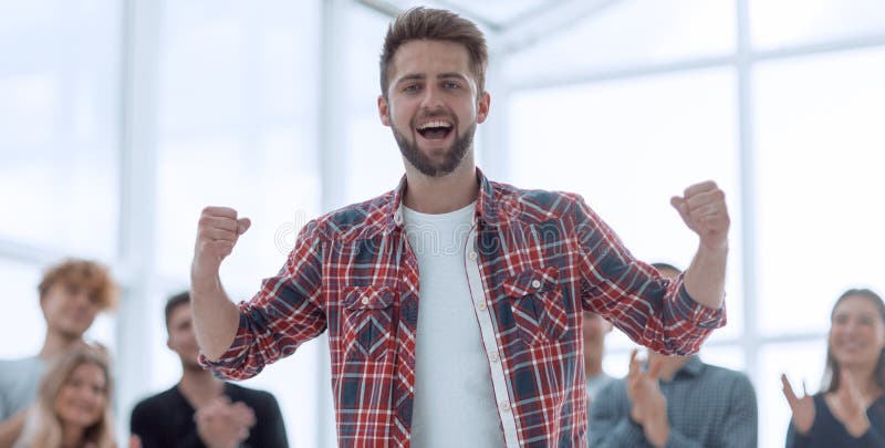 Jubilant Leader Standing in Front of the Business Team. Stock Image ...