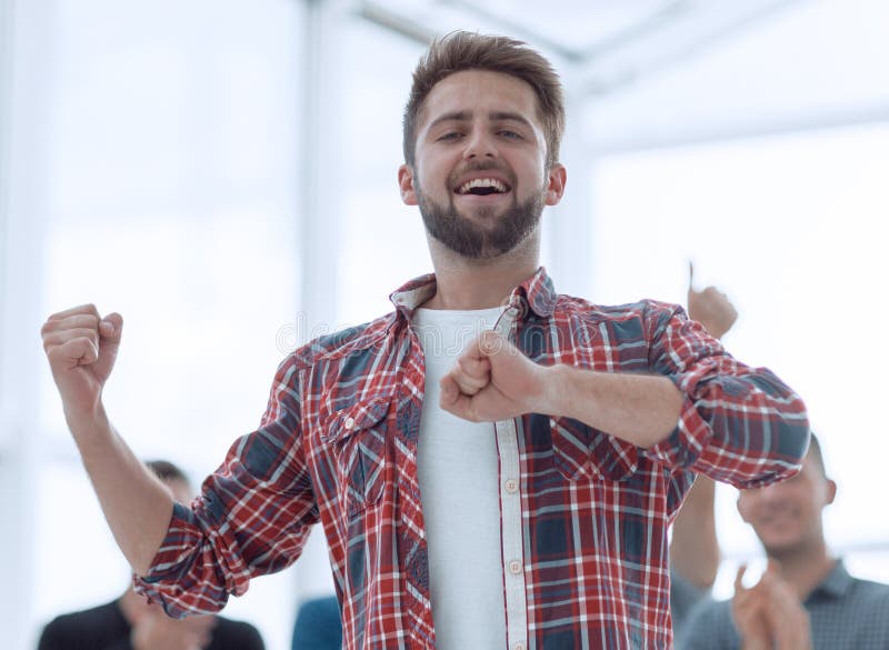 Jubilant Leader Standing in Front of the Business Team. Stock Photo ...