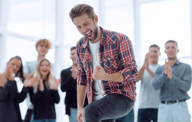 Jubilant Leader Standing in Front of the Business Team. Stock Photo ...