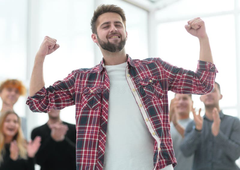 Jubilant Leader Standing in Front of the Business Team. Stock Photo ...