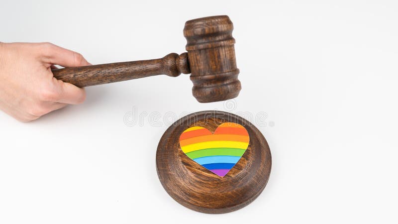 The Judge Hits a Heart with a Rainbow Flag with a Gavel. Stock Photo ...