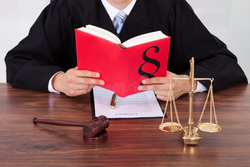 Judge Reading Book at Table in Courtroom Stock Image - Image of ...