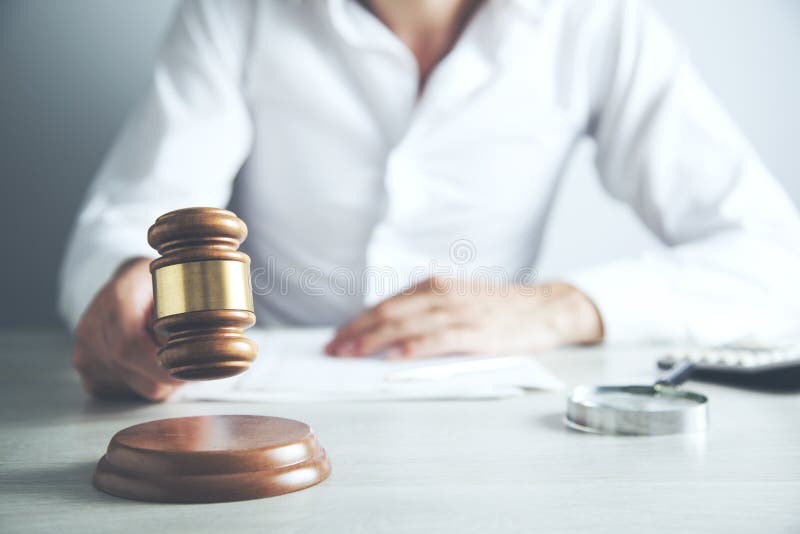 Judge Writing on Paper at Table in Courtroom Stock Photo - Image of ...
