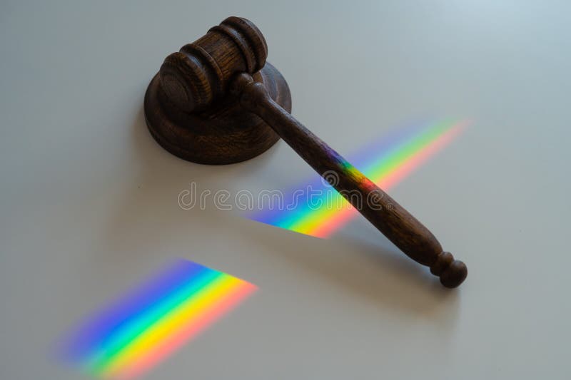 Judicial Gavel on a Table with a Rainbow Light Prism. Stock Image ...