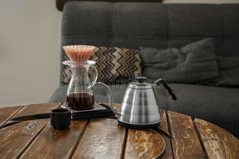 Jug of Coffee with Wave Dripper and Kettle on Wooden Table in Cafe ...